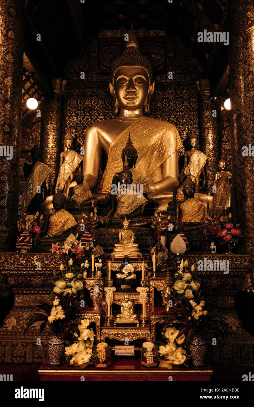 Buddha and altar with ornate design at Wat Xieng Thong, a Buddhist ...