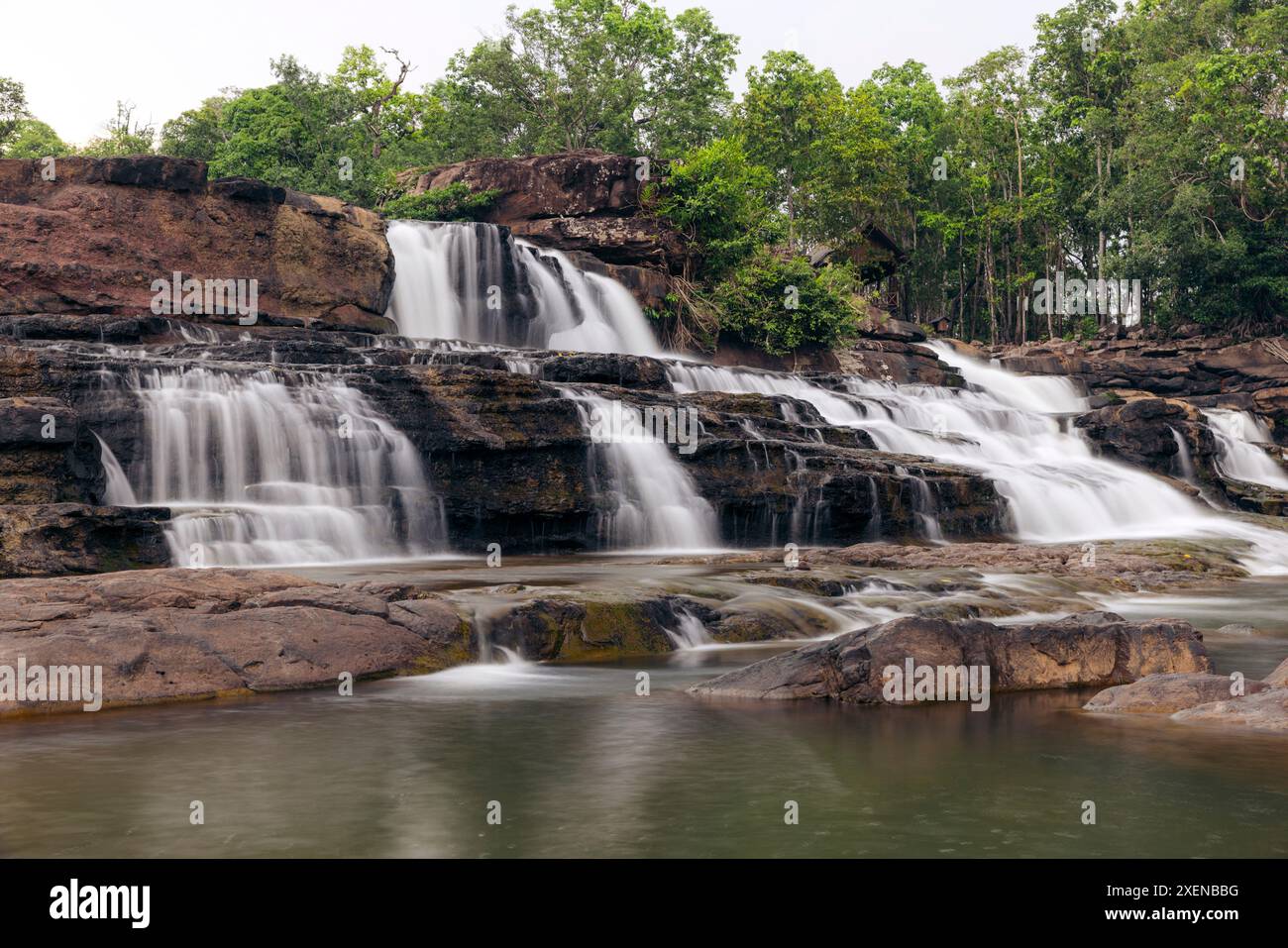 Beautiful splashing cascades of the Tad Lo Waterfall in Laos; Beng ...