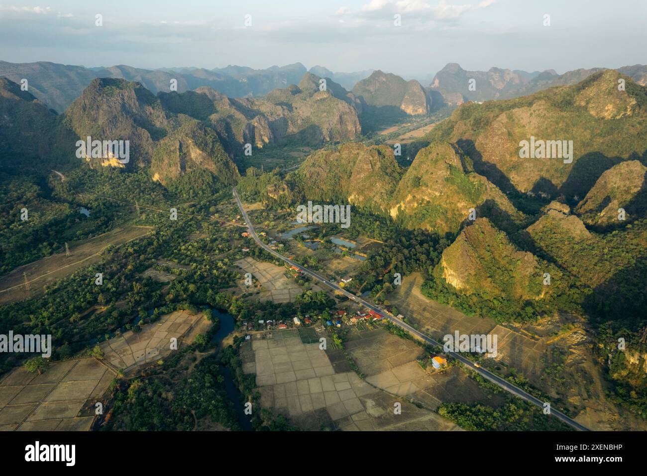 Aerial view of the road in the valley between limestone karst ...