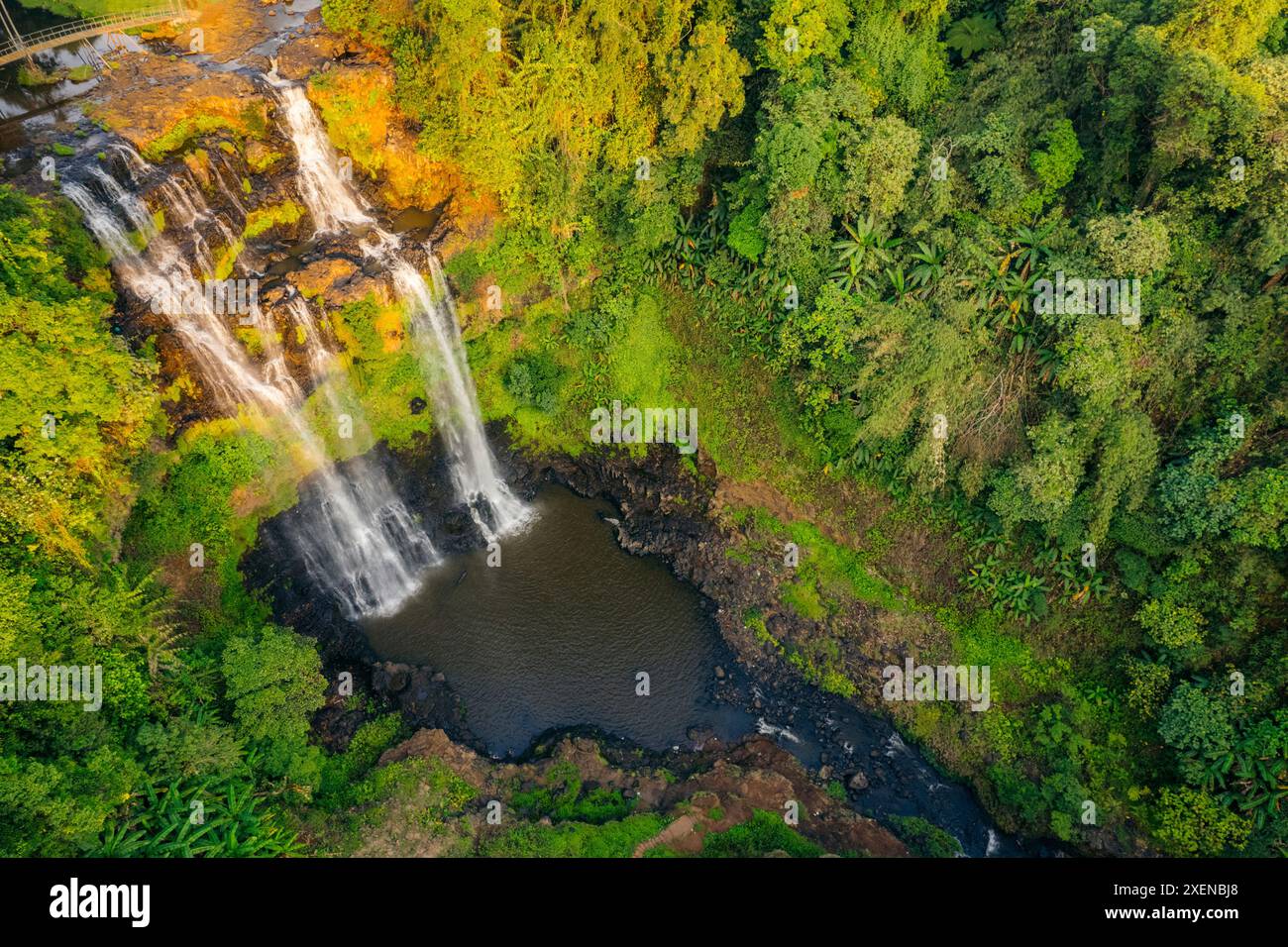 Waterfalls at Tad Gneuang Waterfall, dropping from a high cliff with ...