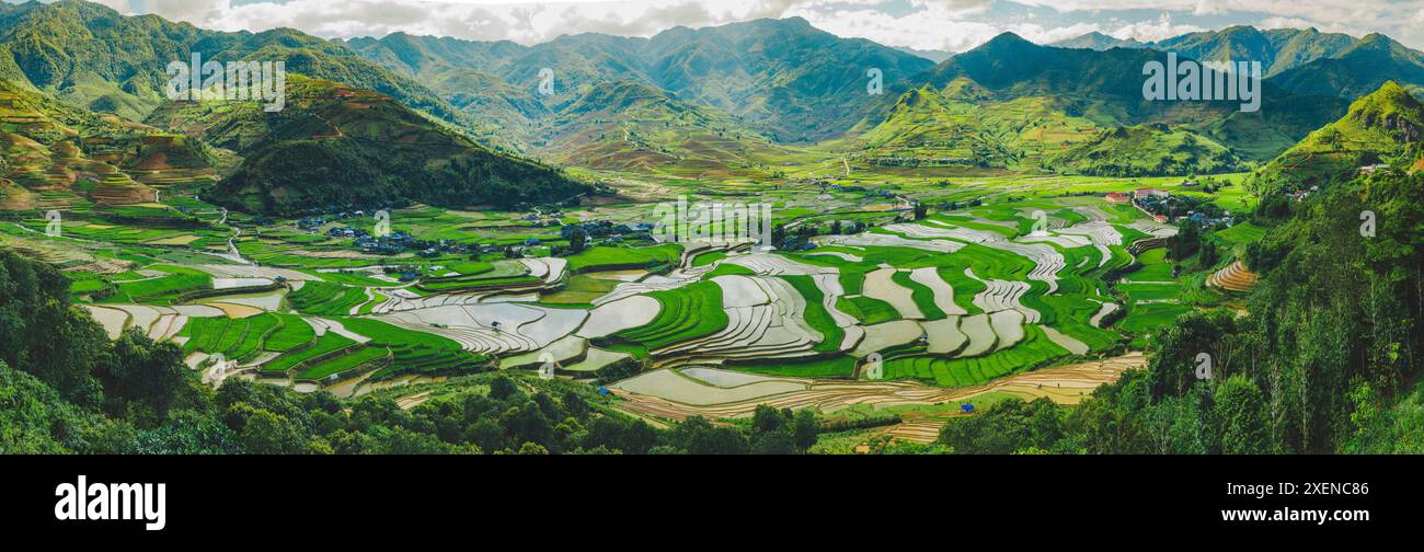 Panoramic view of mountains and terraced farmland in a valley along the ...