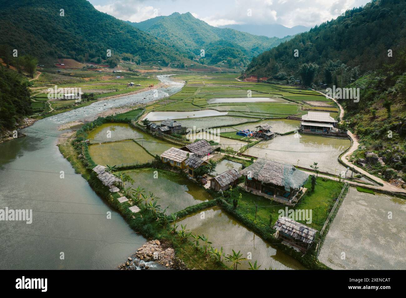 Farming community with rice fields along a river in Vietnam; Ngoc Chien ...
