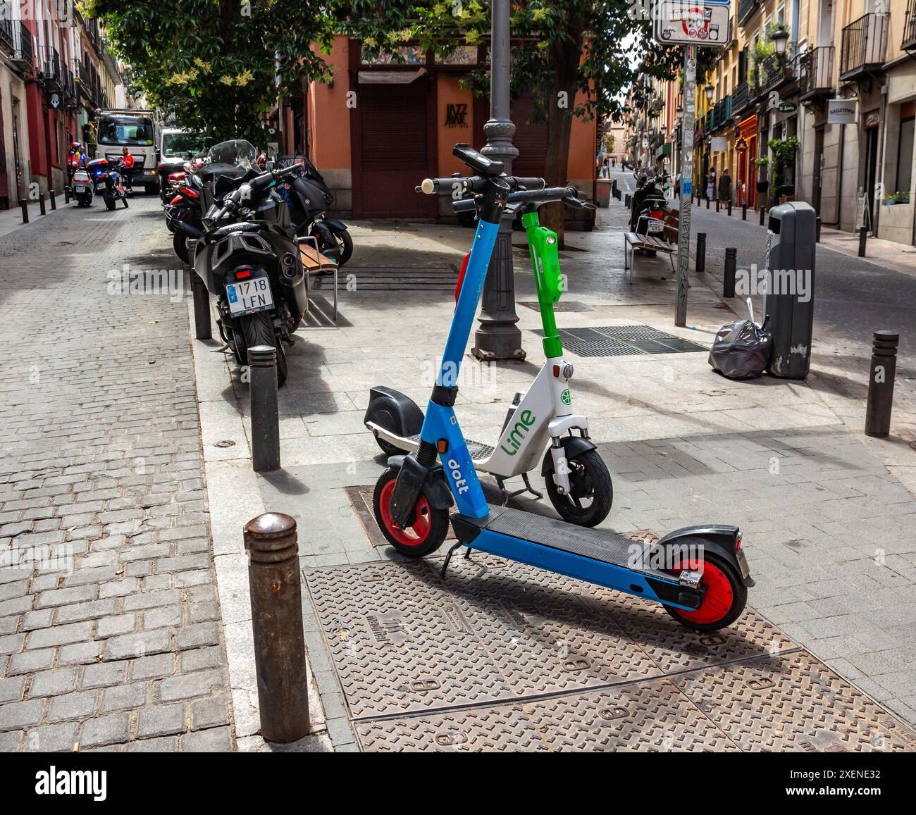 06.19.2024, Madrid, Spain: A Dott and a Lime electric rental mobility ...