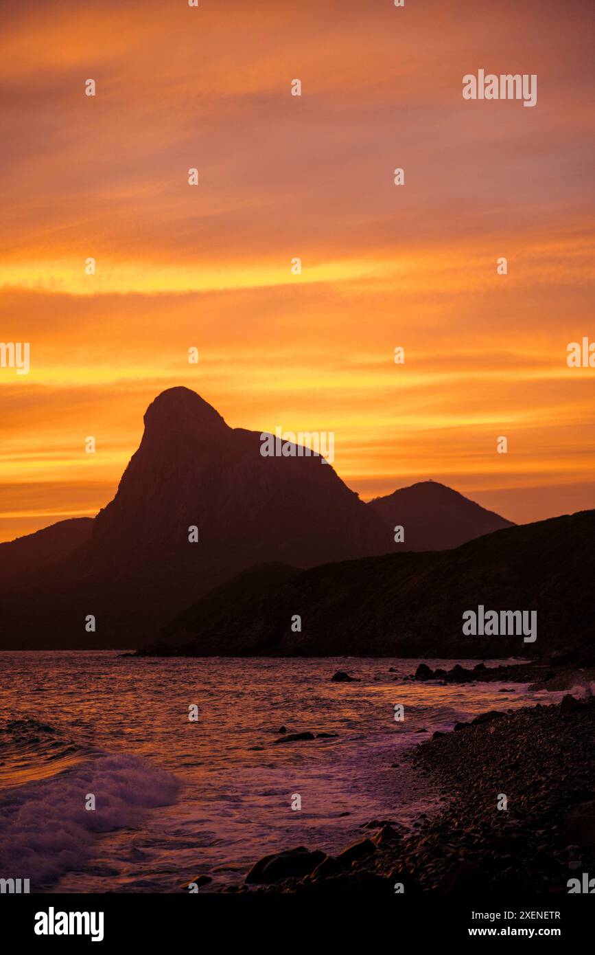 Last light of day under a dramatic glowing golden sky with a ...