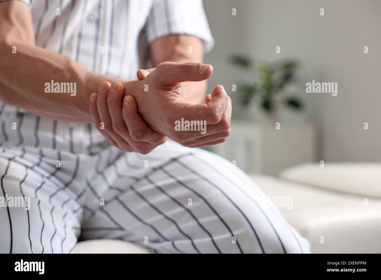Sportsman with injured hand in hospital, closeup Stock Photo - Alamy