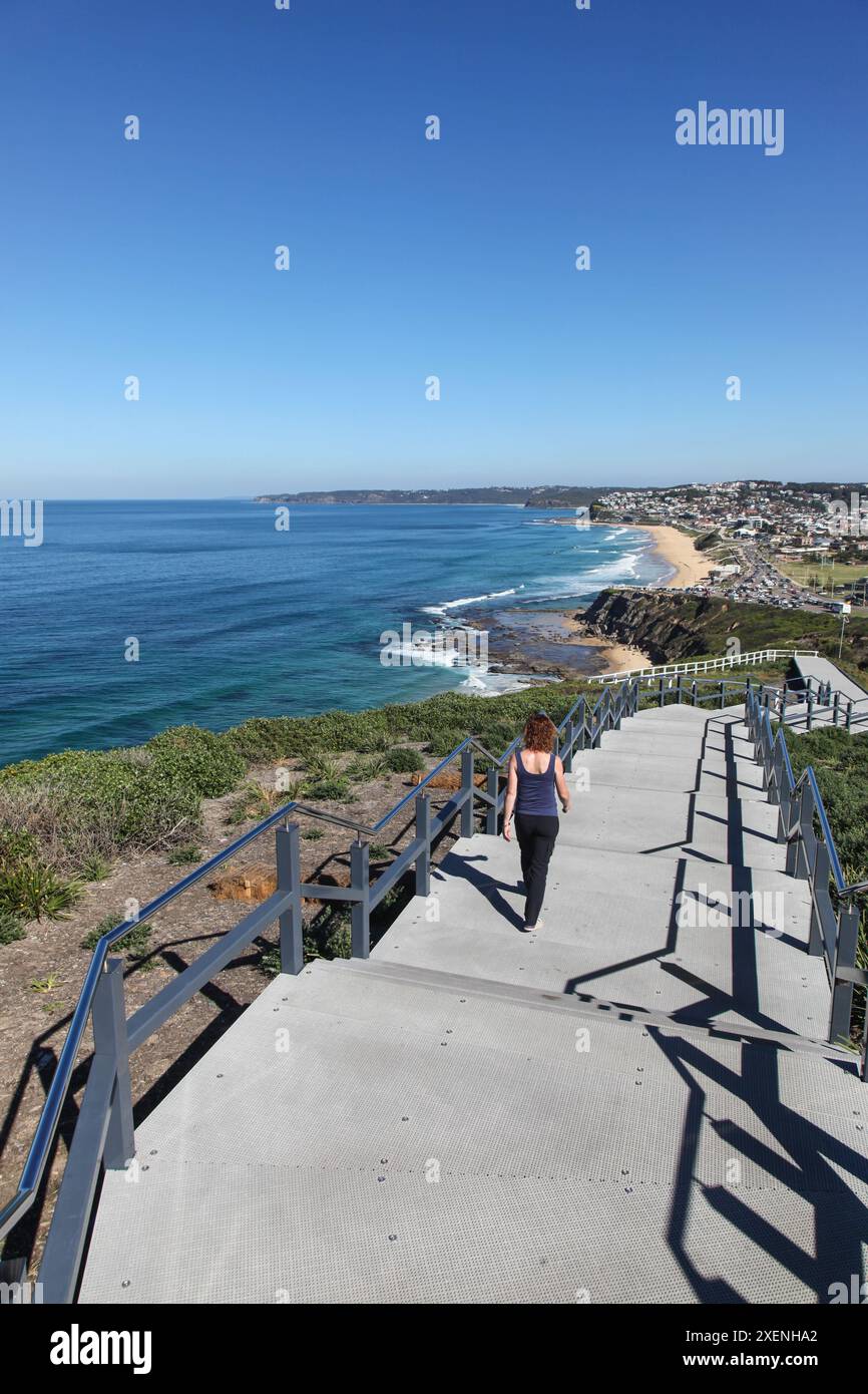 A woman walks along a newly constructed section of the Newcastle ...
