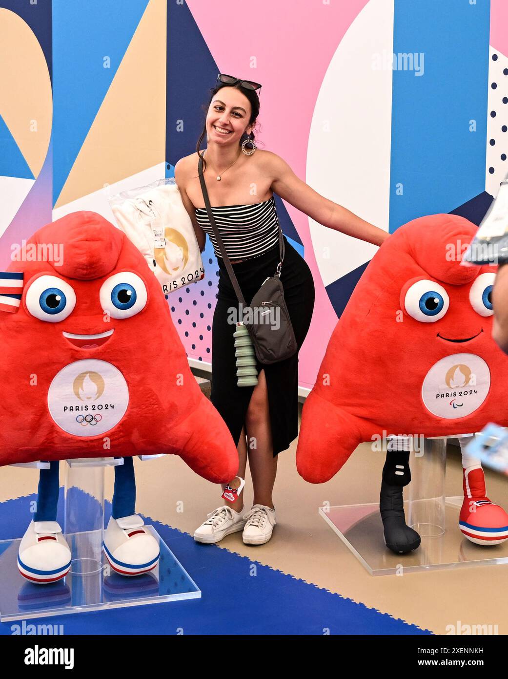 Paris, France. 27th June, 2024. A customer poses for photos with the ...