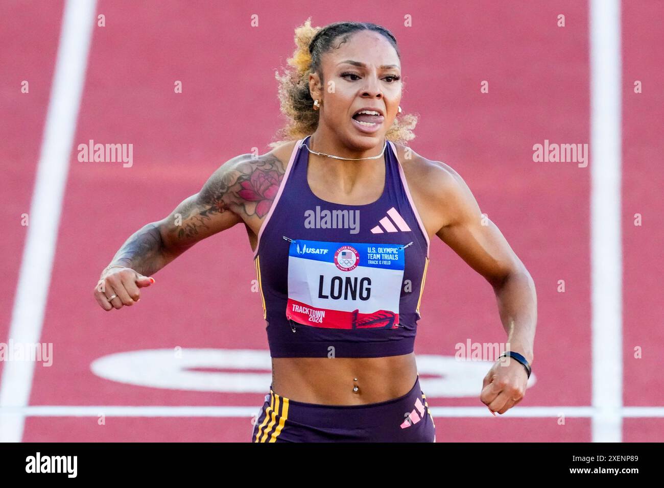 McKenzie Long wins a heat women's 200-meter semi-finals during the U.S ...