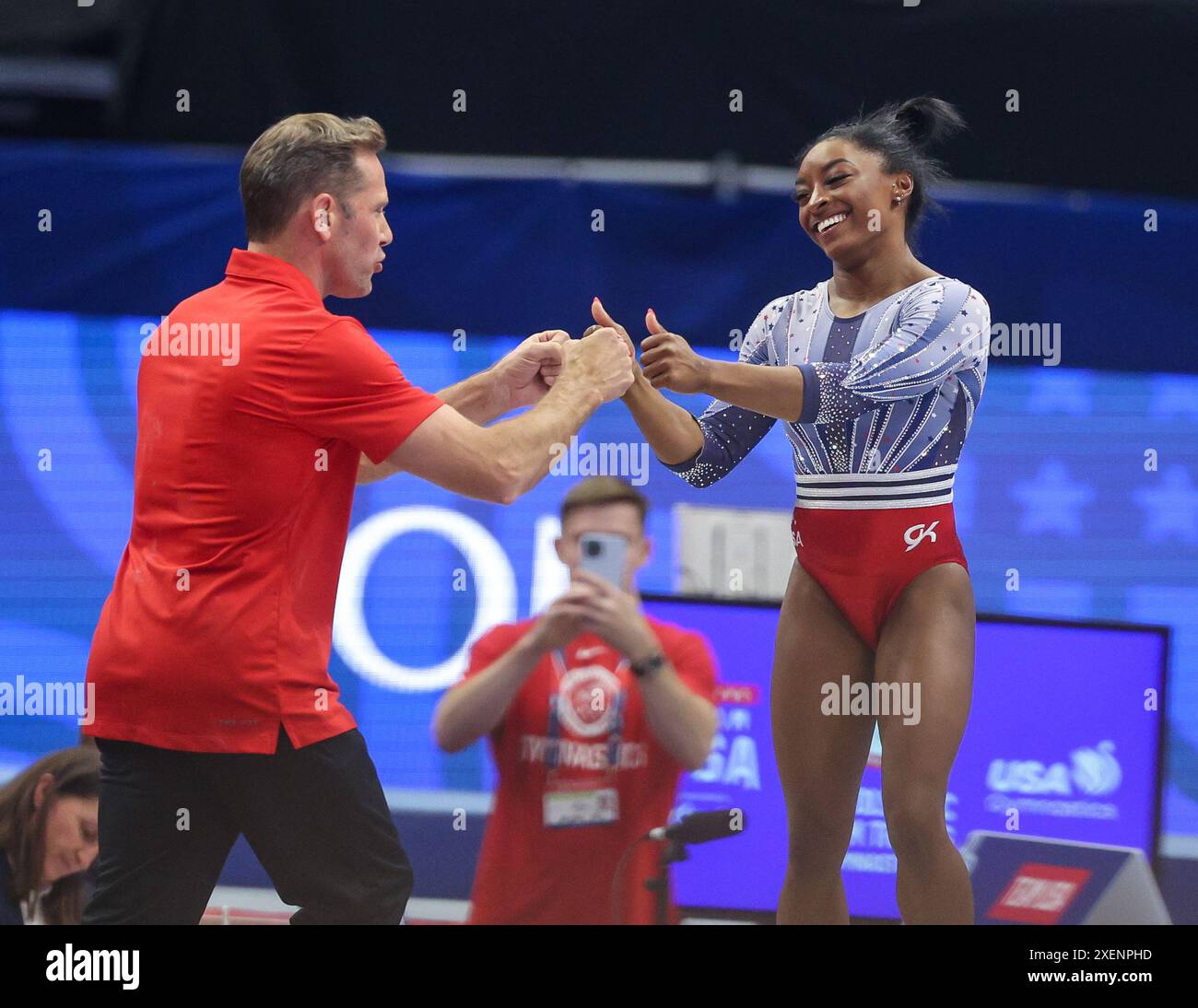 June 28, 2024: Simone Biles fist bumps her coach, Laurent Landi ...