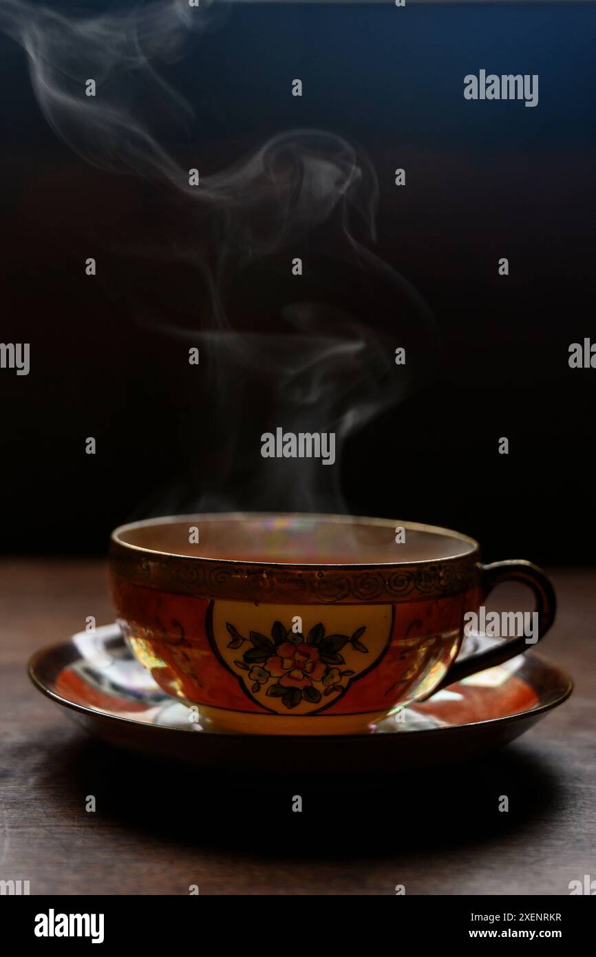 Japan cup containing hot tea, steam is seen Stock Photo - Alamy
