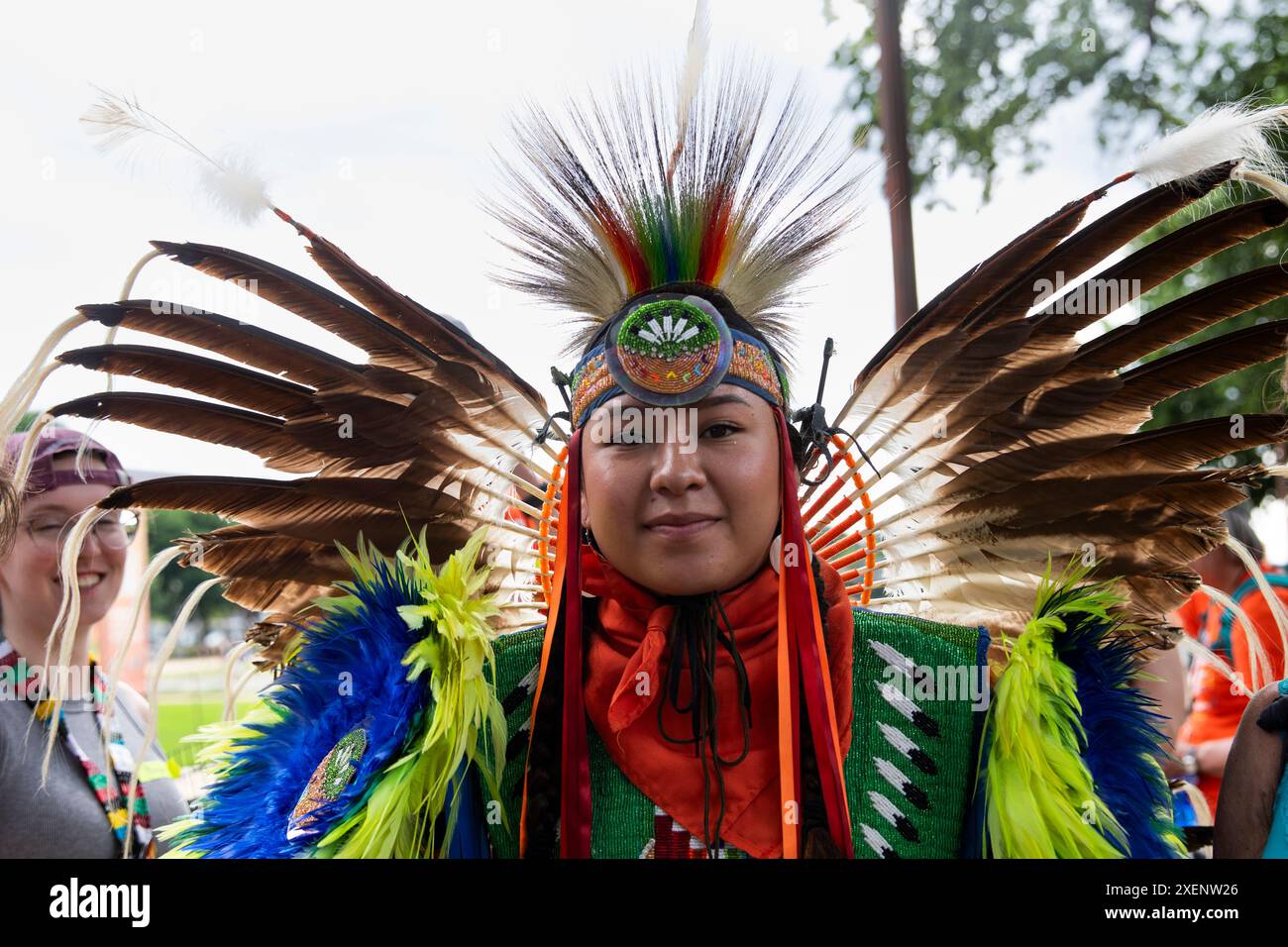 An indigenous performer poses for photographs during the Smithsonian ...