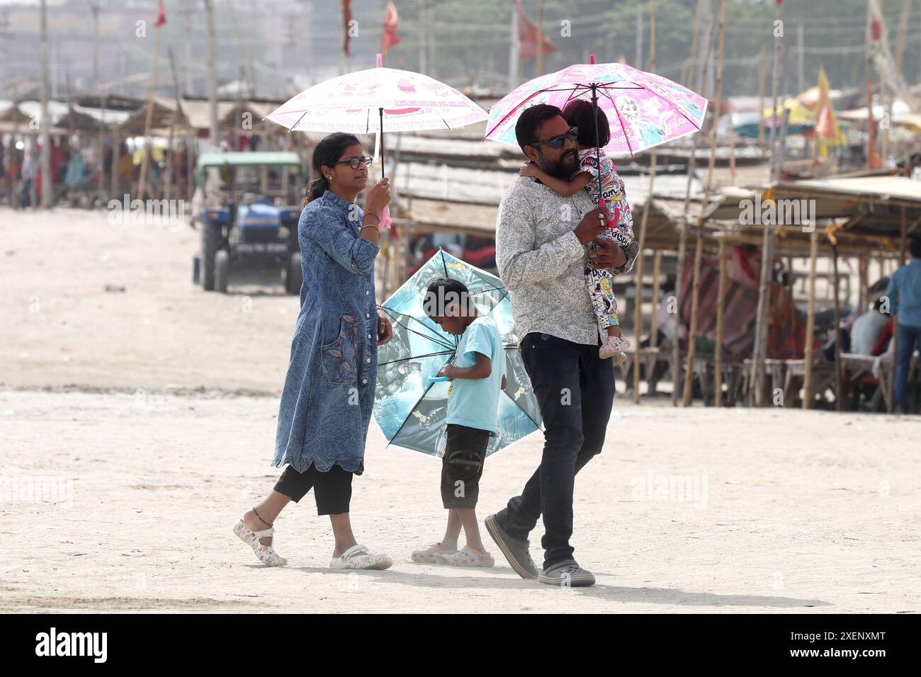 Indian people walk around the banks of river Ganges during the Heat ...