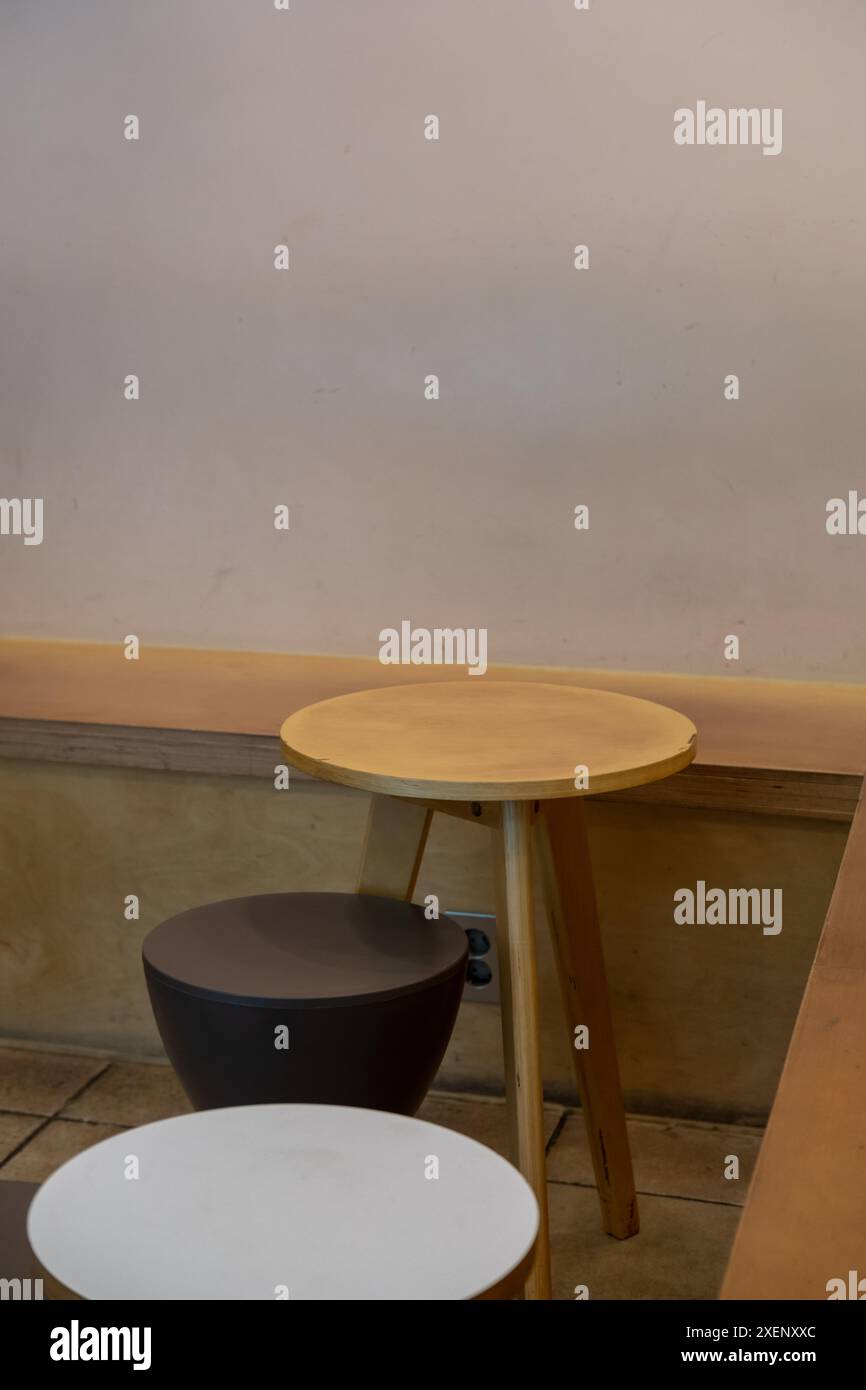 Seating inside the cafe or restaurant, with wooden chairs and table ...
