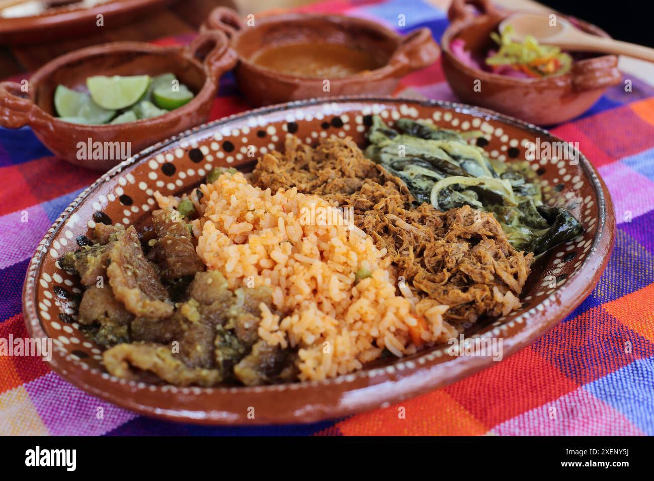 Plate of Traditional mexican food with chicharron, rice, cochinita and ...