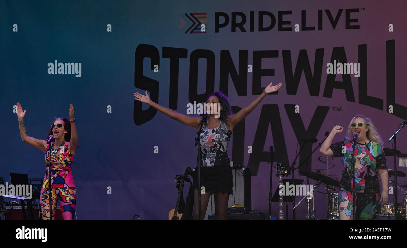 Betty (Elizabeth Ziff, Alyson Palmer, Amy Ziff) performs on stage ...