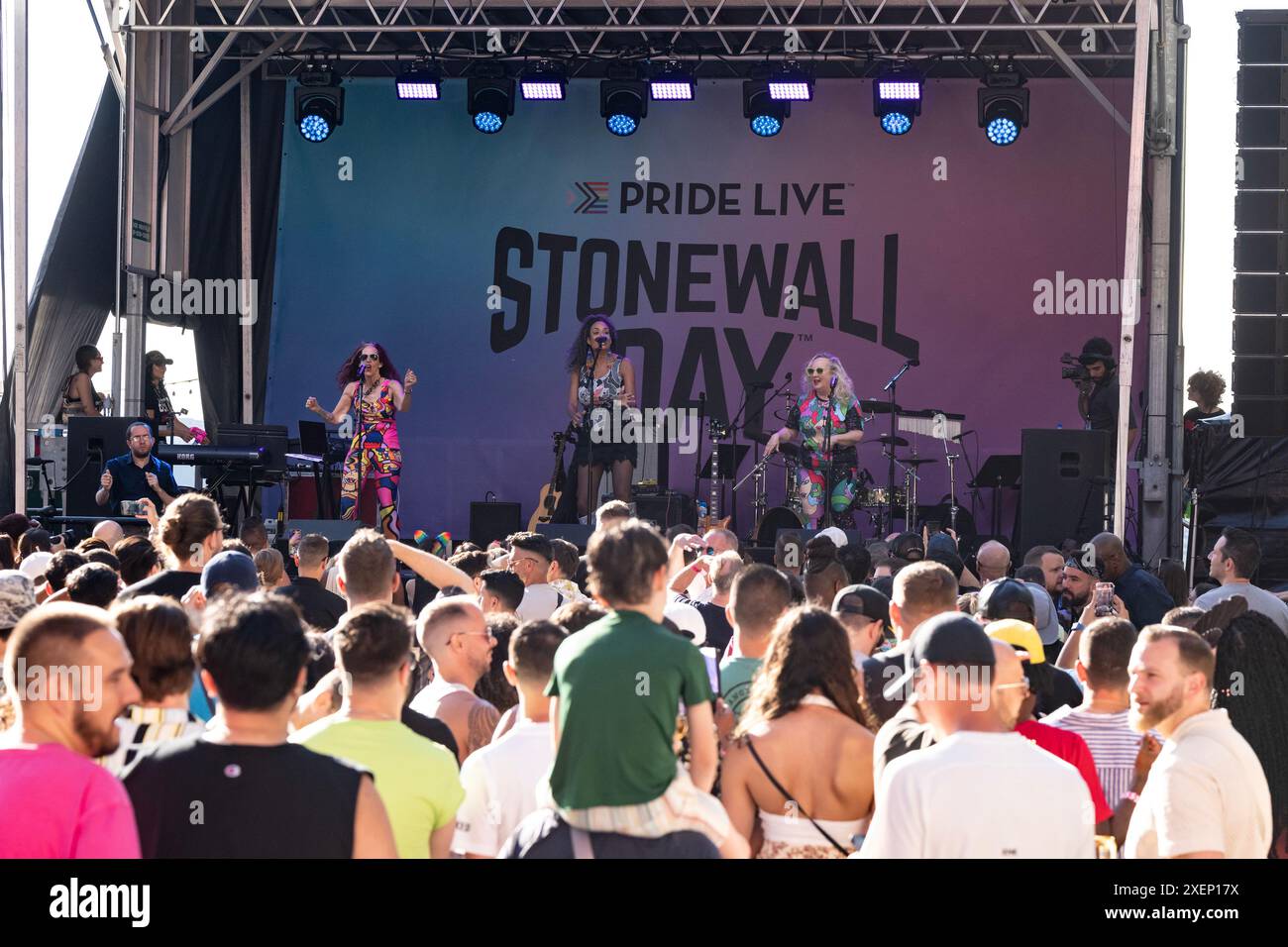 Betty (Elizabeth Ziff, Alyson Palmer, Amy Ziff) performs on stage ...