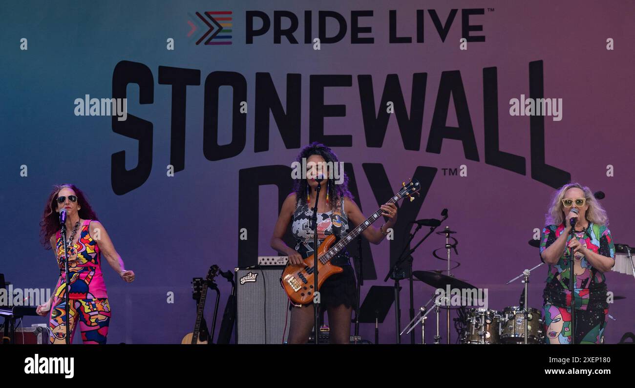 Betty (Elizabeth Ziff, Alyson Palmer, Amy Ziff) performs on stage ...