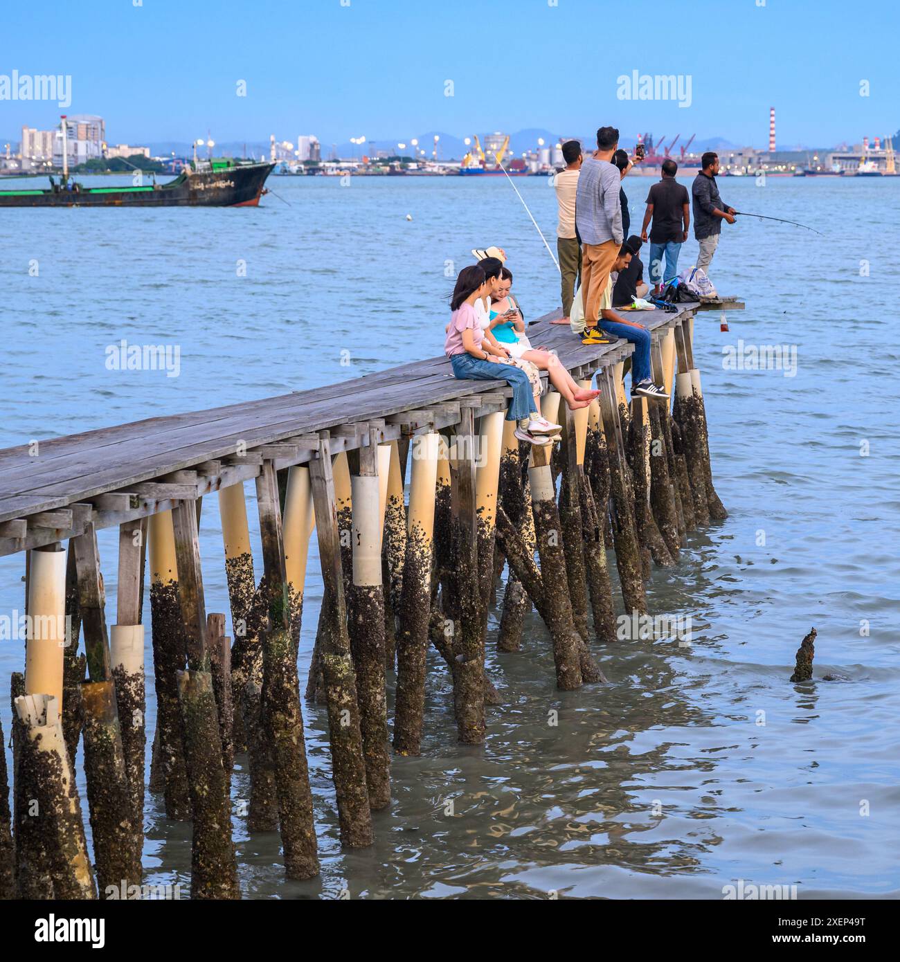 Fishing from the Tan Jetty, George Town, Penang, Malaysia Stock Photo ...