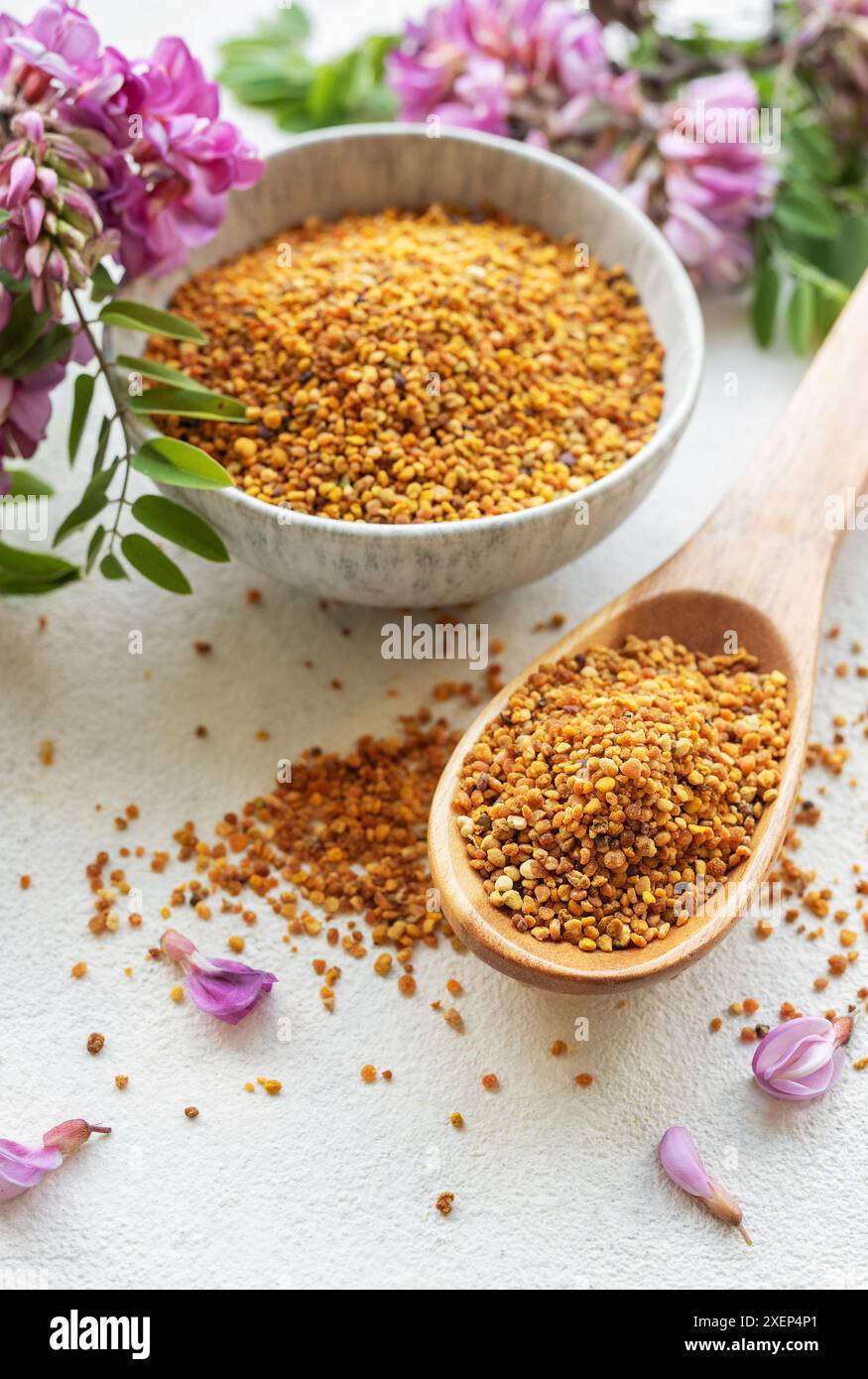 Healthy bee pollen grains. Bee pollen on a bowl and acacia flowers ...