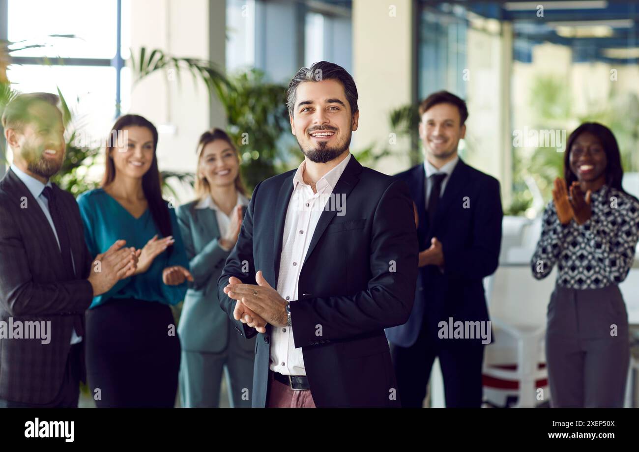 Portrait of happy successful company CEO and business team leader with ...