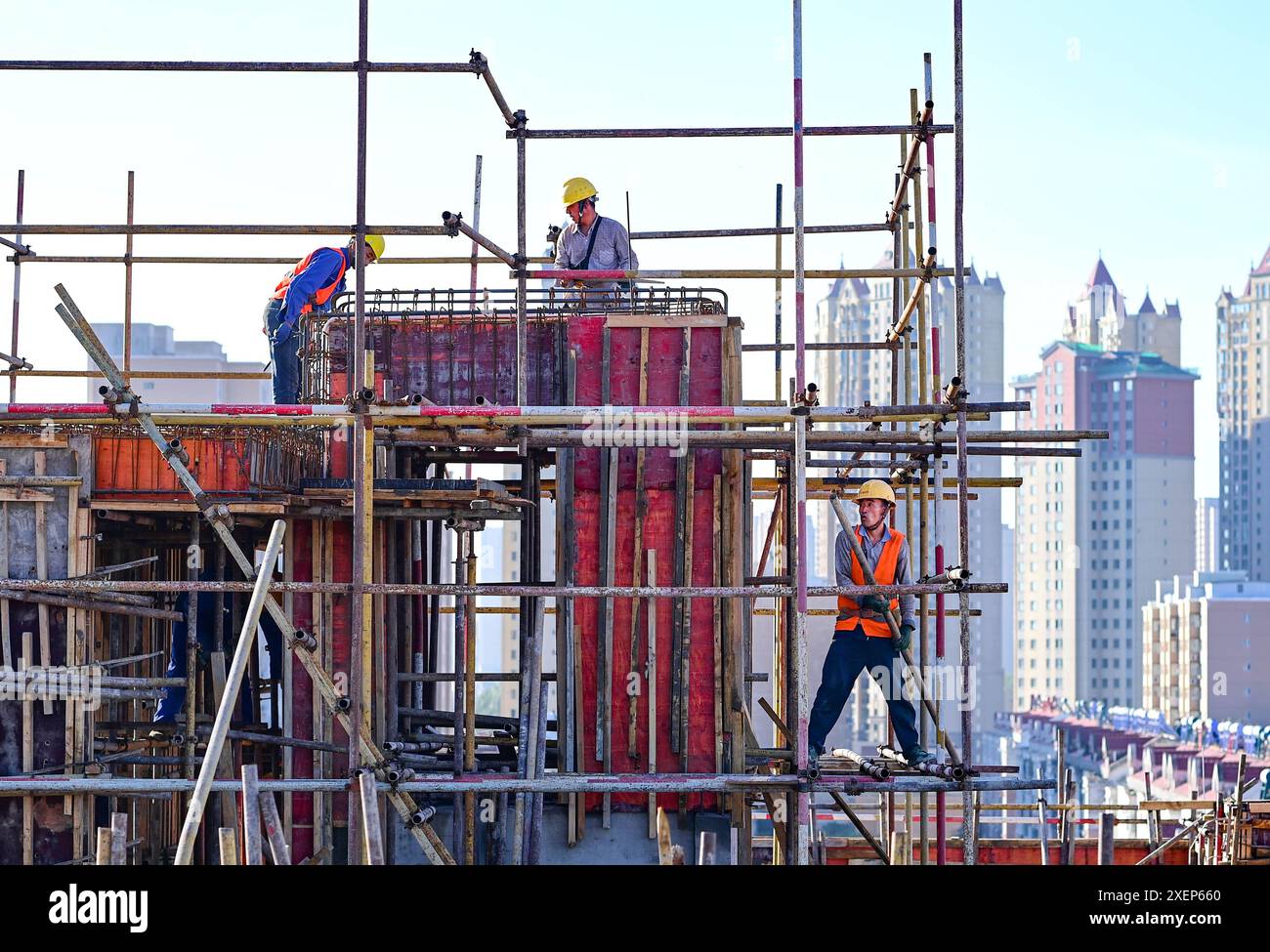 BAOTOU, CHINA - JUNE 29, 2024 - Builders work at the construction site ...