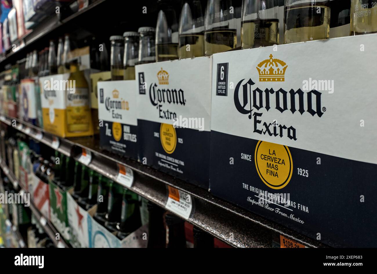 Beer bottle six packs on a store shelf in a supermarket including ...