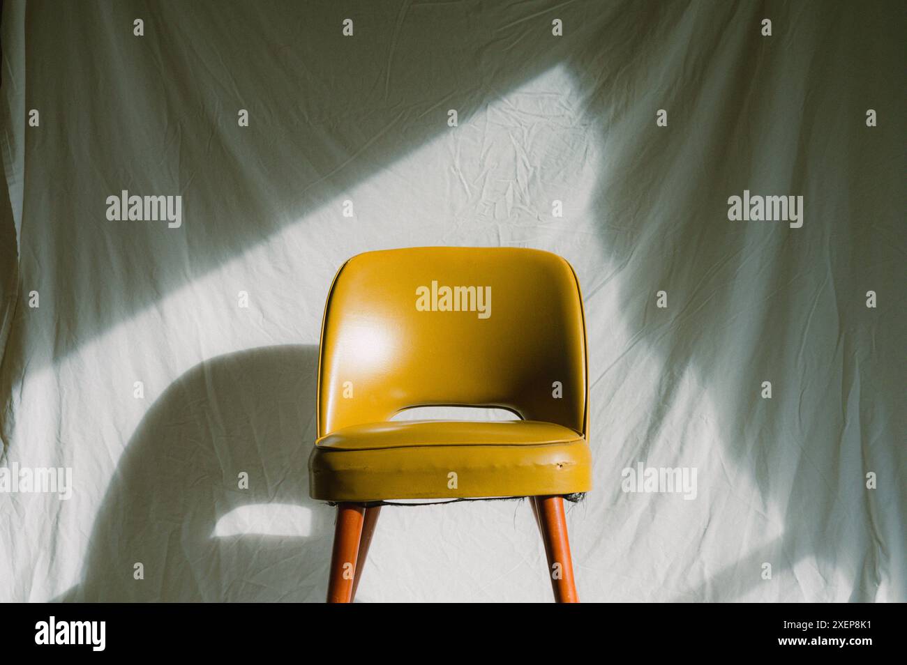Green chair with backdrop Stock Photo - Alamy