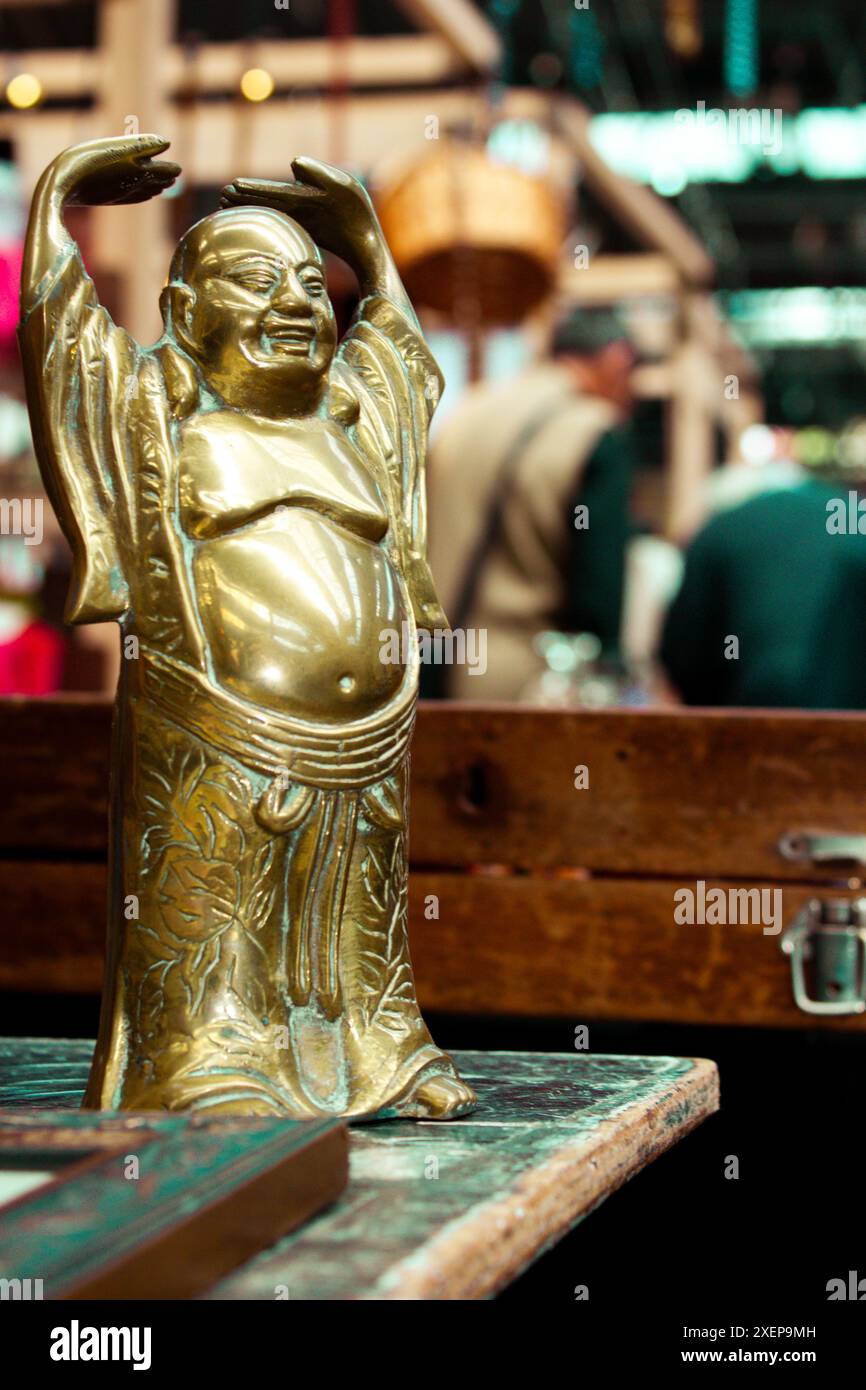 A statue of Buddha on a market stall Stock Photo - Alamy
