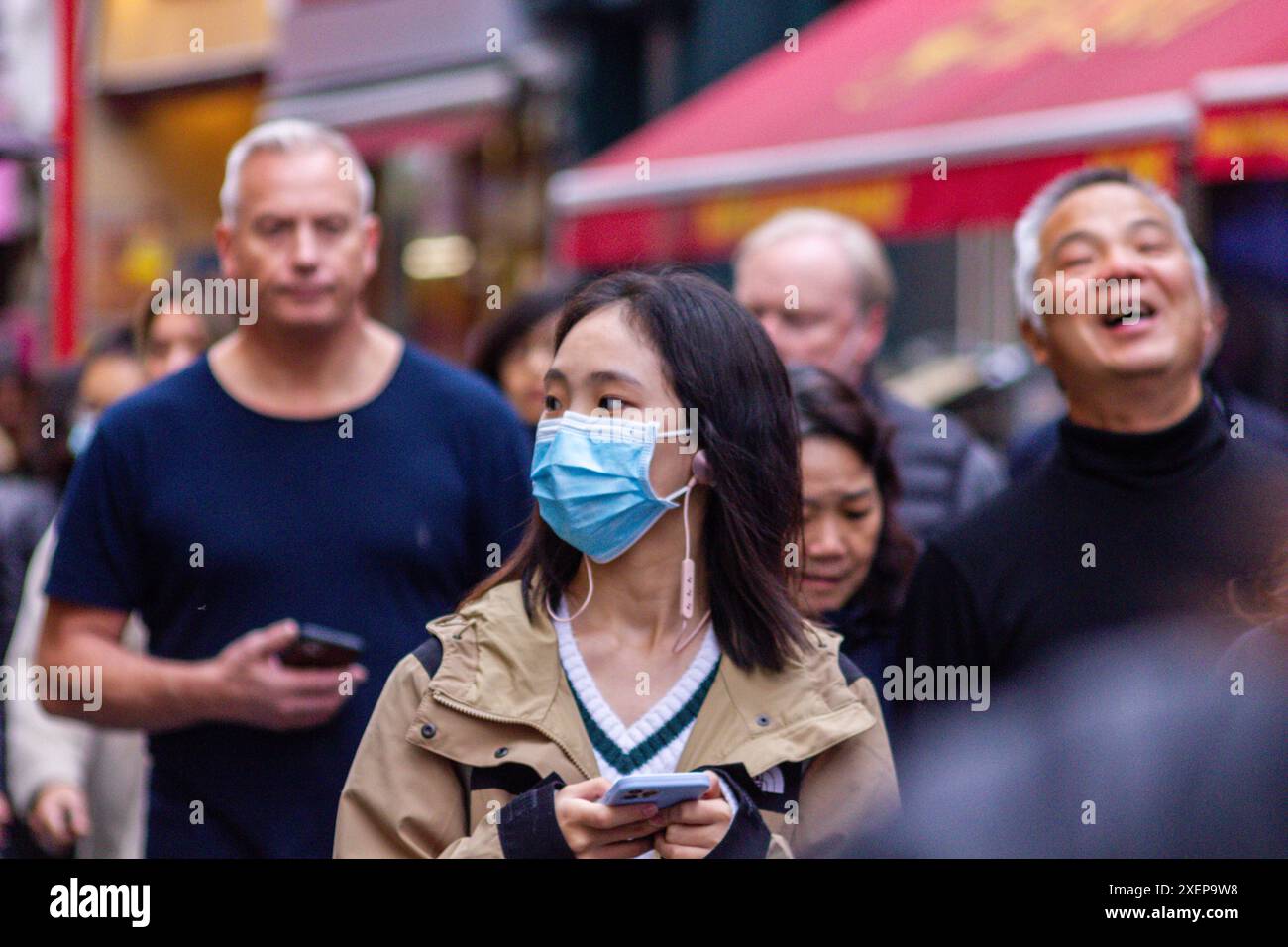 Mask wearing pedestrians hi-res stock photography and images - Alamy