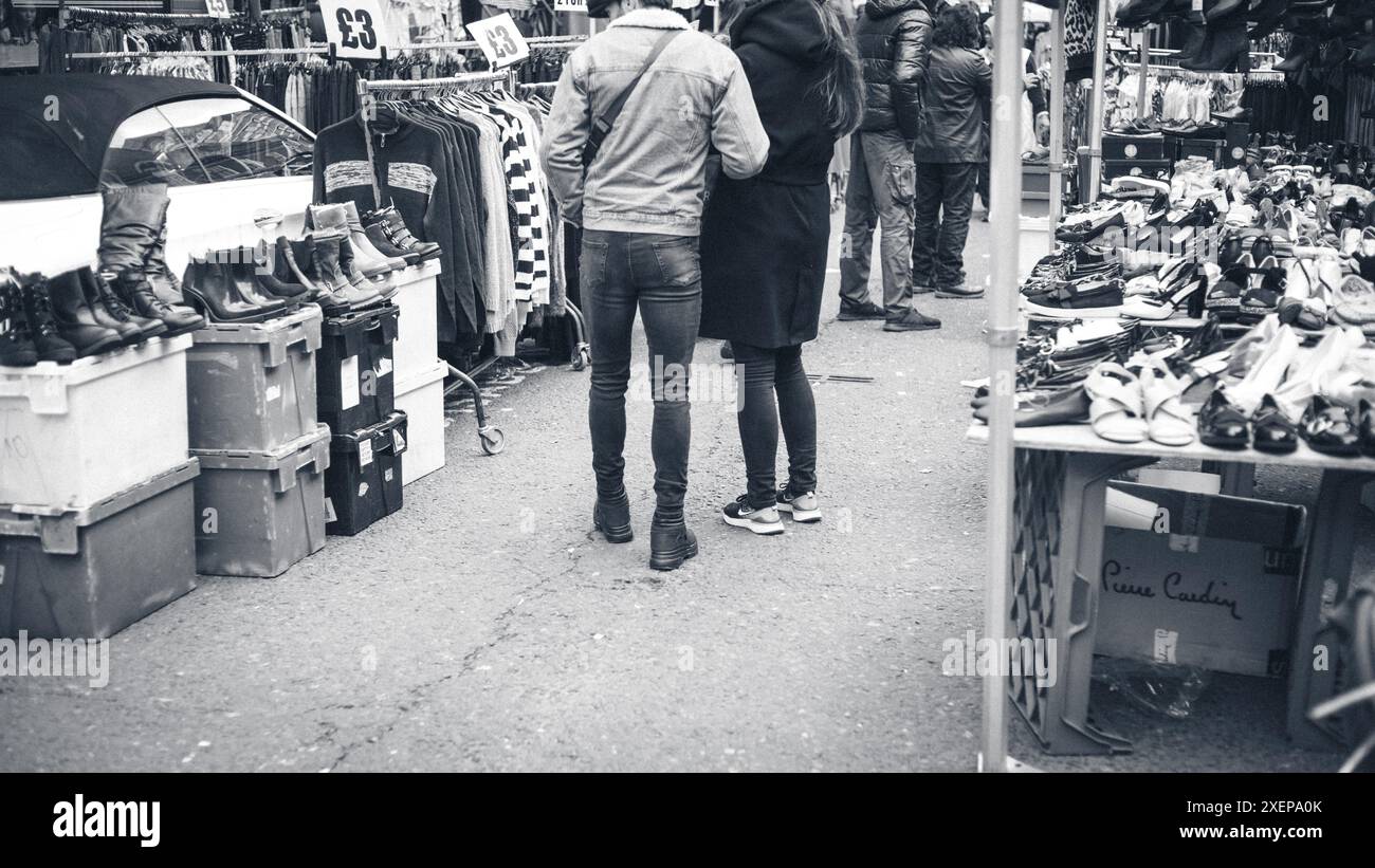 Shoppers looking bargains street hi-res stock photography and images ...