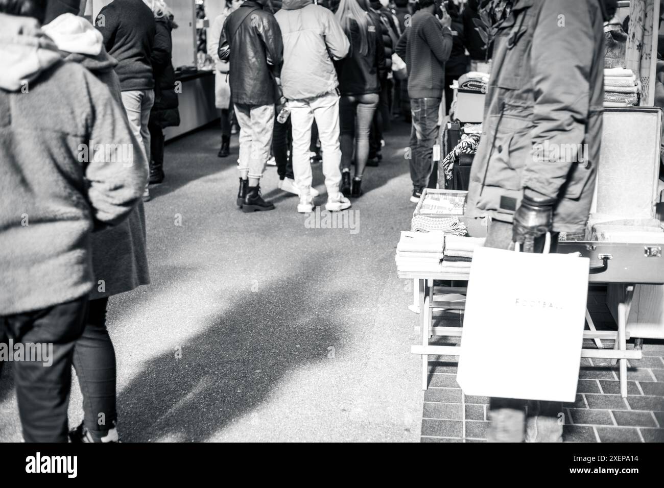 legs of pedestrians and shoppers walking along the pavement Stock Photo ...