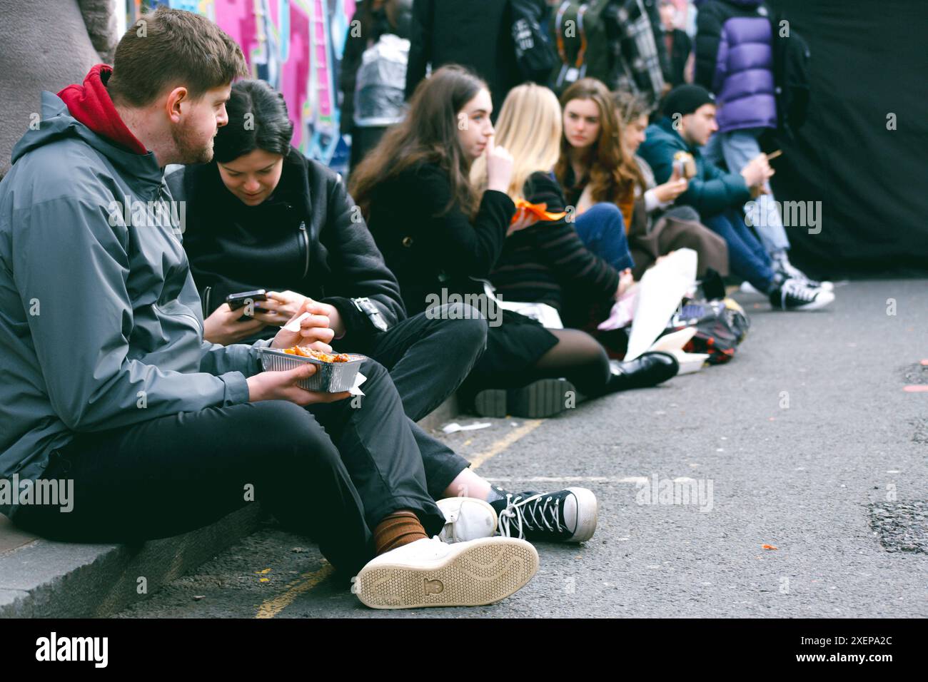 Male female students sitting hi-res stock photography and images - Alamy