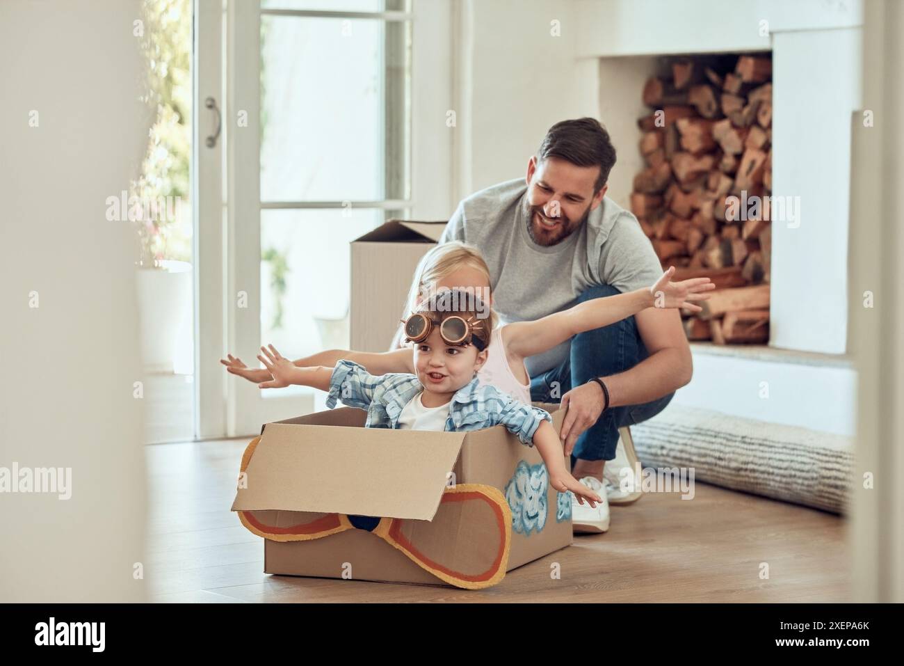 Dad, children and home with cardboard airplane for playing, happiness ...
