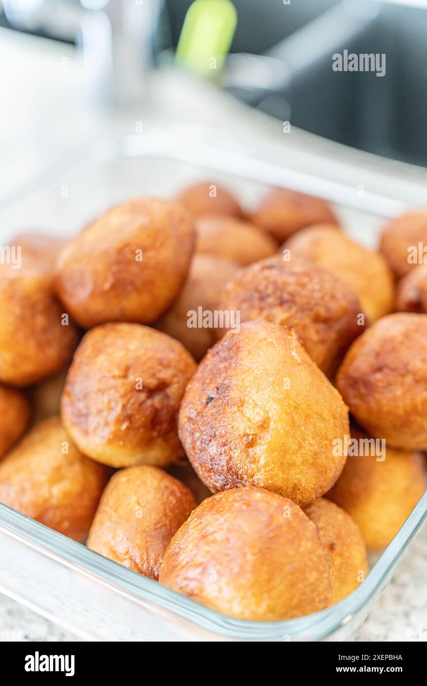 Deep fried Nigerian Puff Puff Snack ready to eat Stock Photo - Alamy