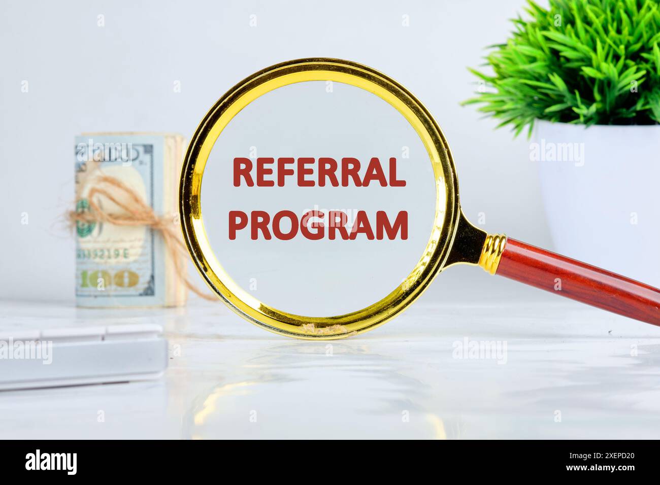 REFERRAL PROGRAM word. text written on a desktop calendar on a white ...