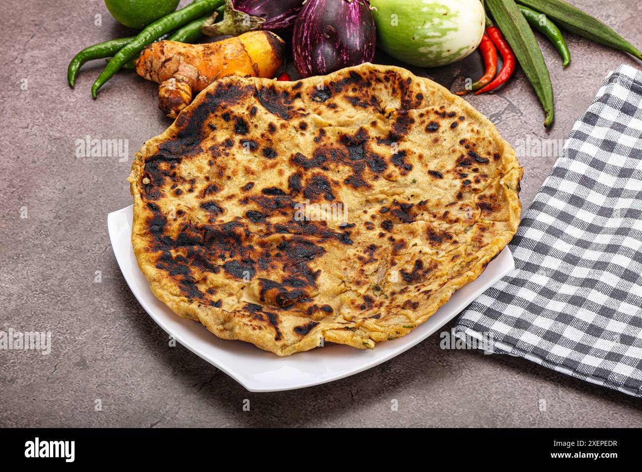 Indian cuisine stuffed Aloo paratha - bread with potato Stock Photo - Alamy