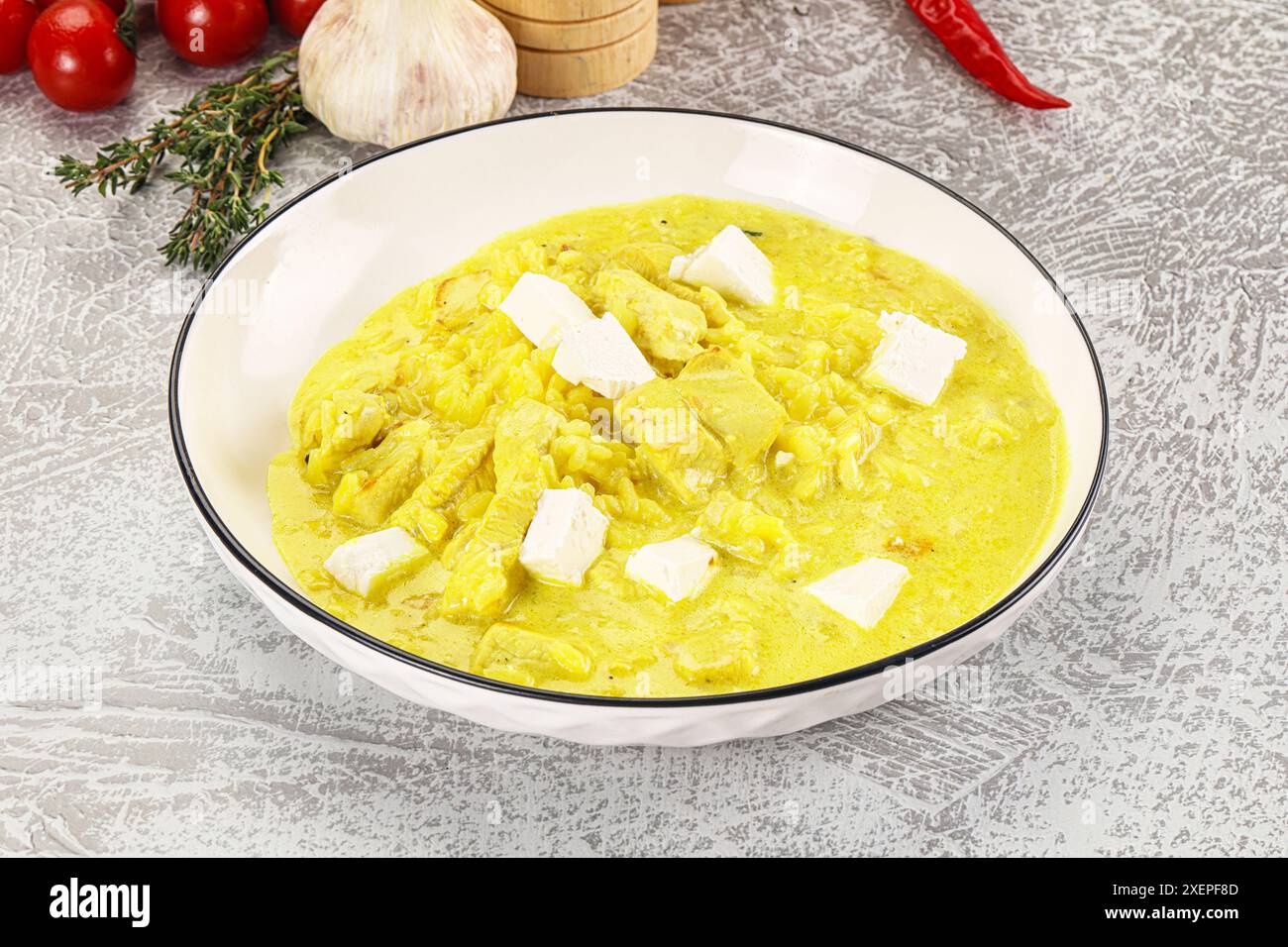 Italian cuisine - yellow risotto with chicken and soft cheese Stock ...