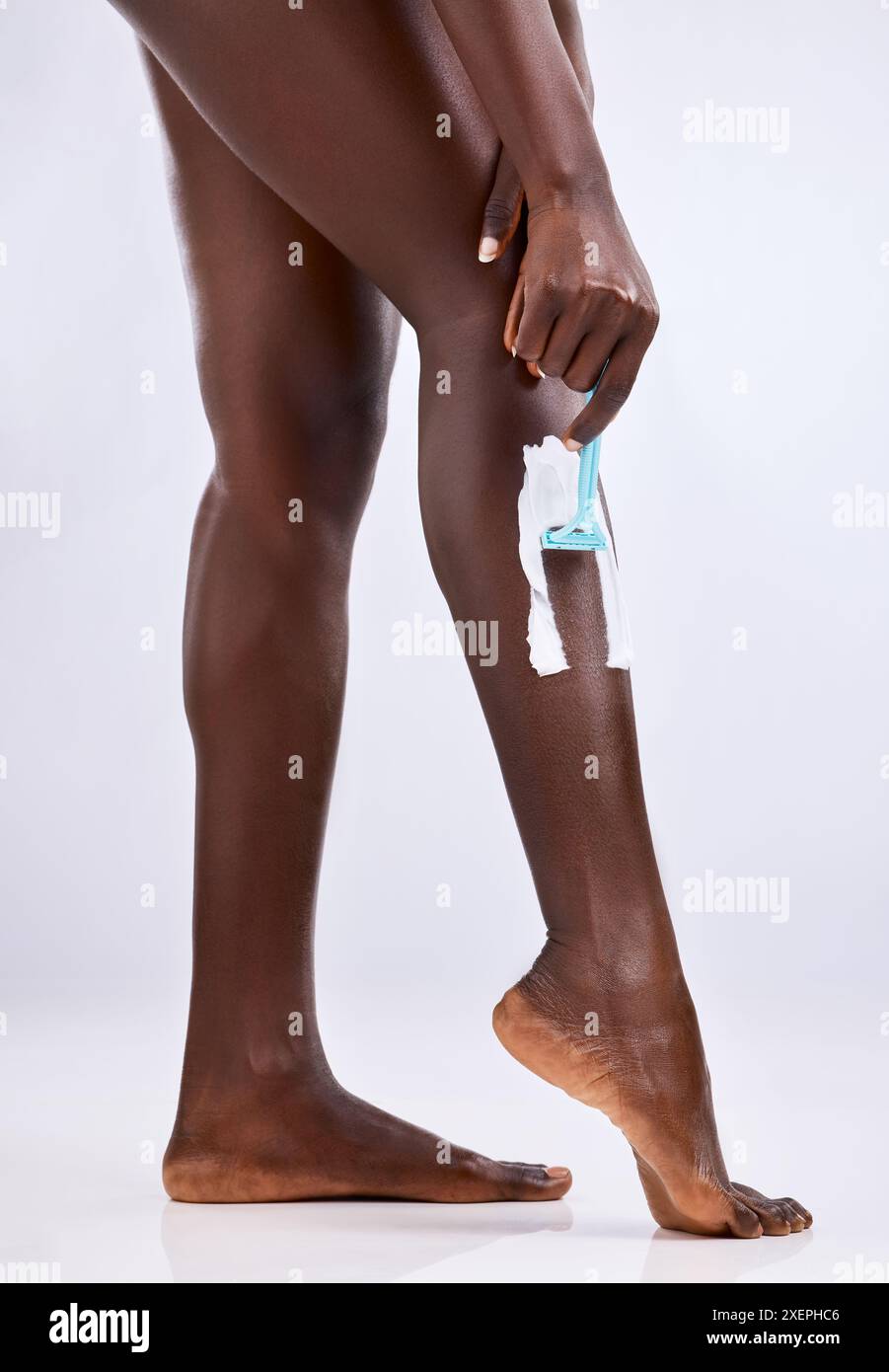 Legs, woman and shaving with foam for beauty, skincare or hygiene ...