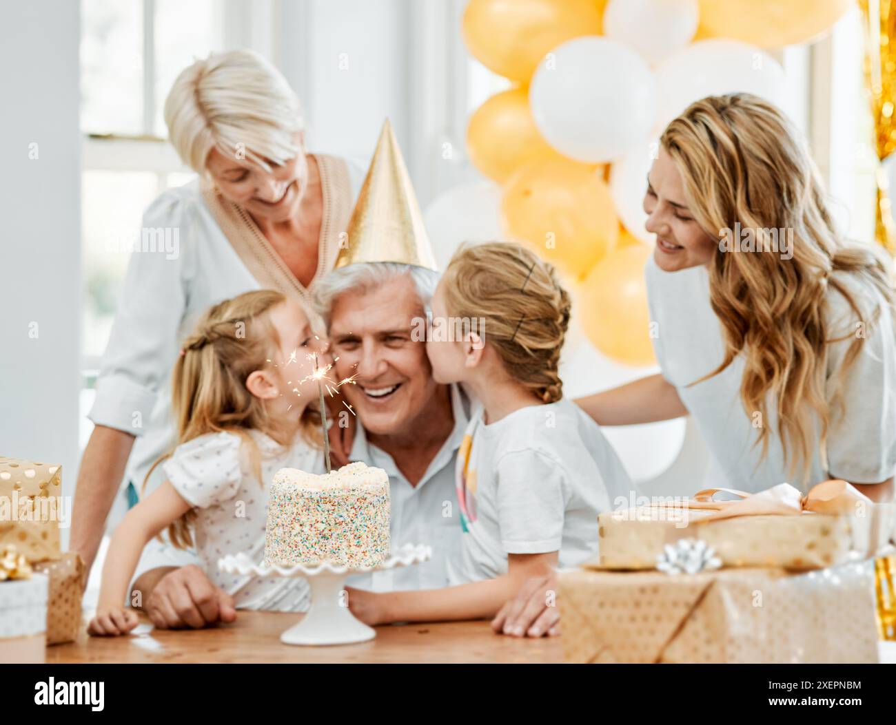 Big family, birthday cake and celebration in home with kiss, sparkle ...