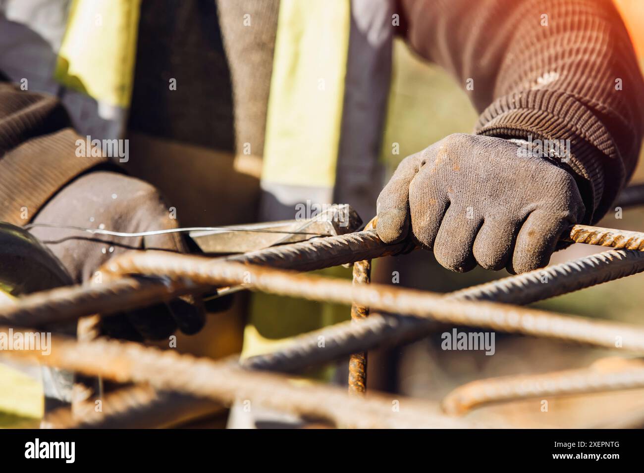 Construction worker steel fixer working at the building site close-up ...