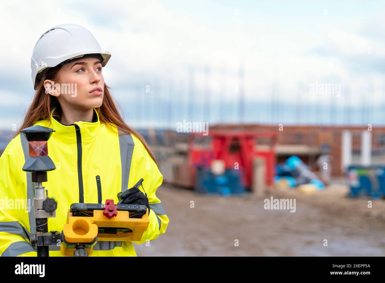 Female site engineer surveyor working with theodolite total station EDM ...