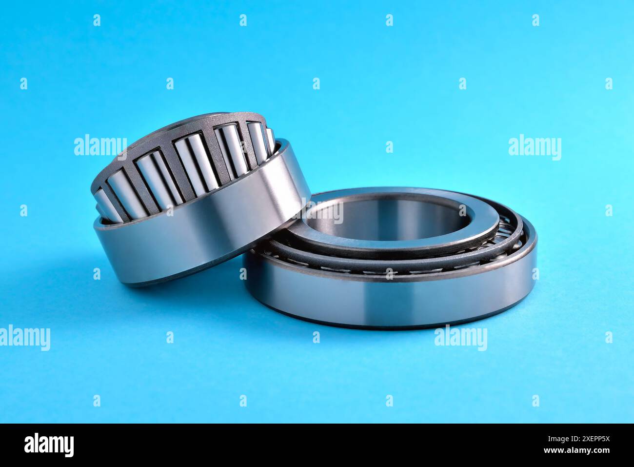 roller bearings on a blue background, blank for creativity. Parts for ...