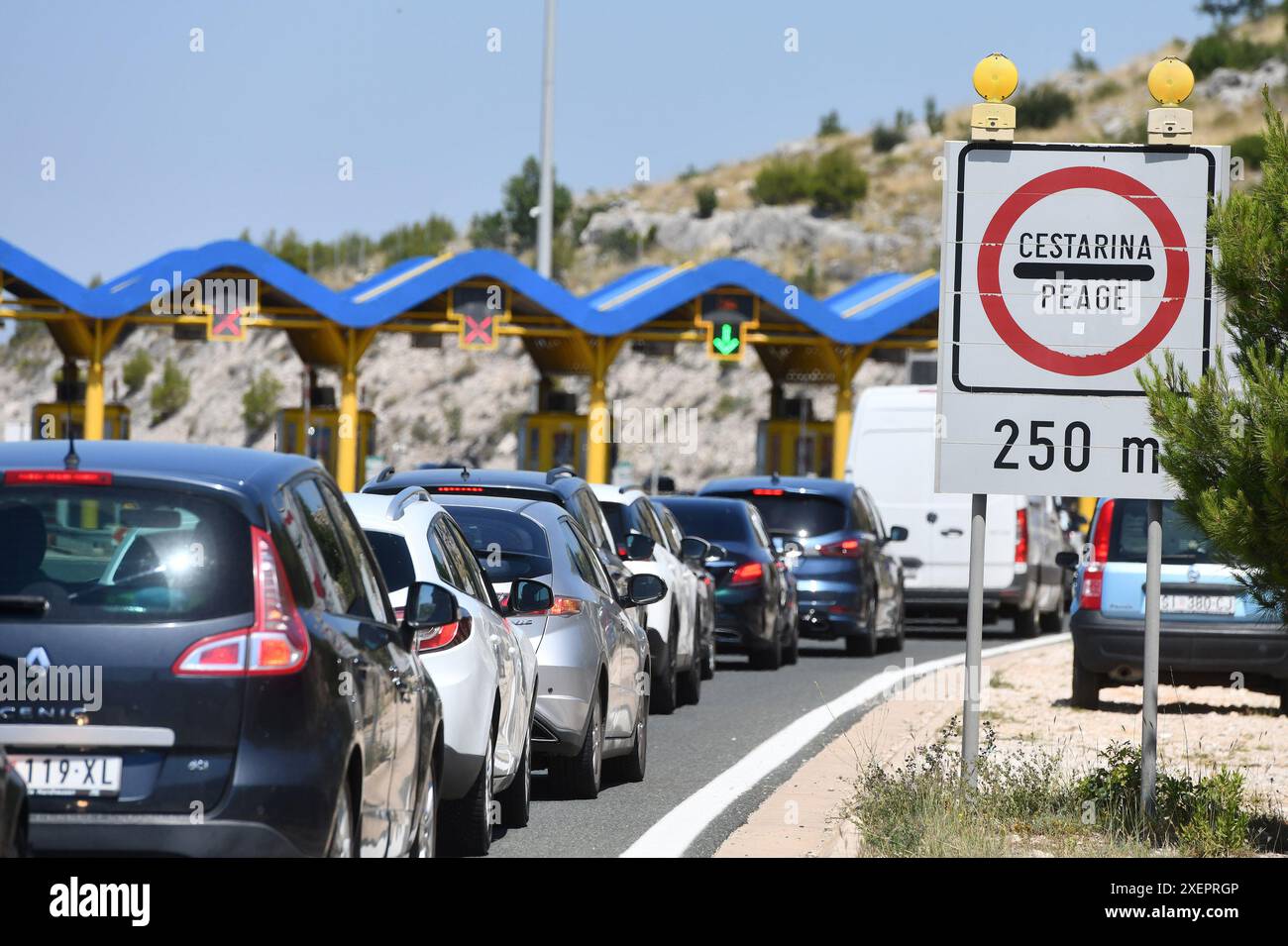 Sibenik, Croatia. 29th June, 2024. Cars form a queue at a toll station ...