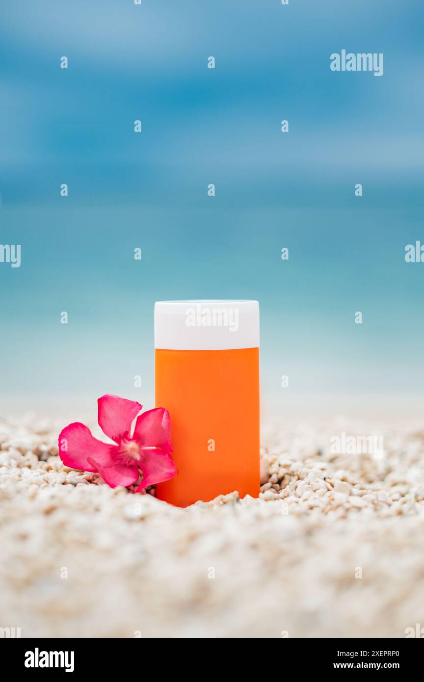 Sunscreen bottle on the beach Stock Photo - Alamy