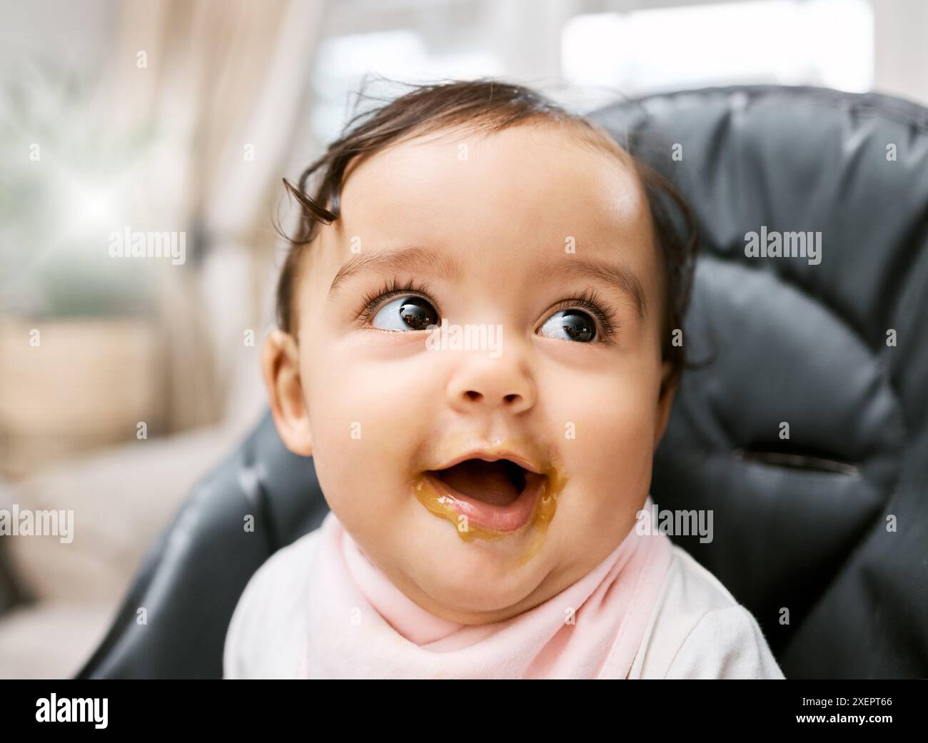 Baby, messy face and food on mouth for eating with growth, hungry and ...