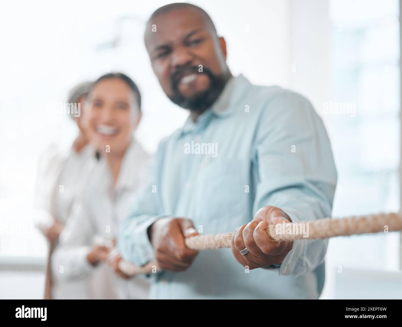 Office, man and leader pulling rope with strength for team build ...