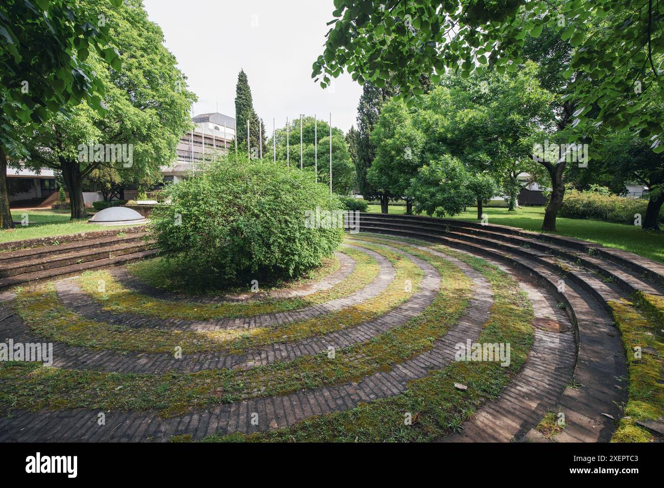 In the city park, lush greenery and beautiful landscaping create a ...