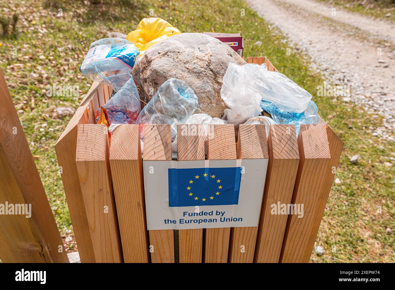 05 May 2024, Plav, Montenegro: Garbage bin with banner - sponsored by ...