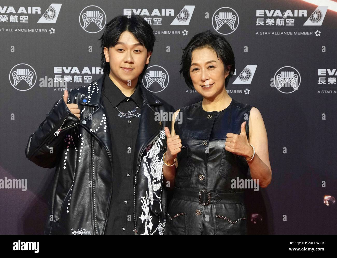 Taiwanese singer Kay Huang, right, and her son Arthur Shen pose for a ...