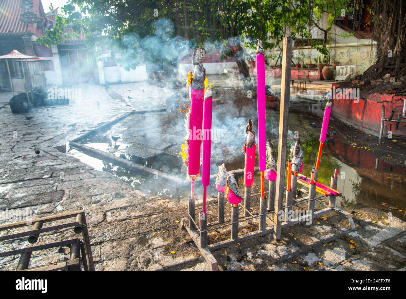 Huge red purple joss sticks are burning contantly,at a Hindu temple in ...
